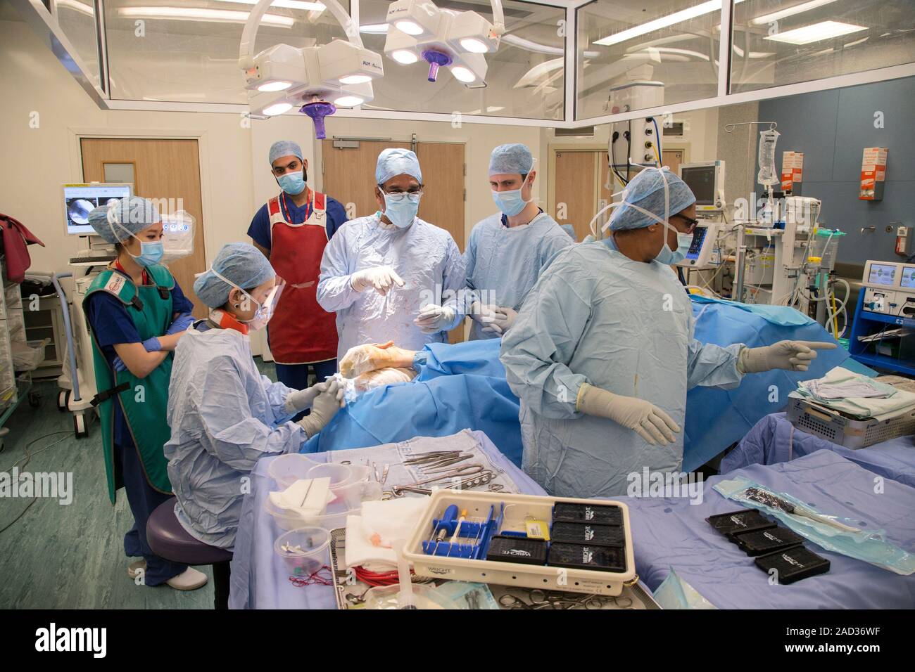 Heel bone surgery. Surgeons and a support team carrying out an ...