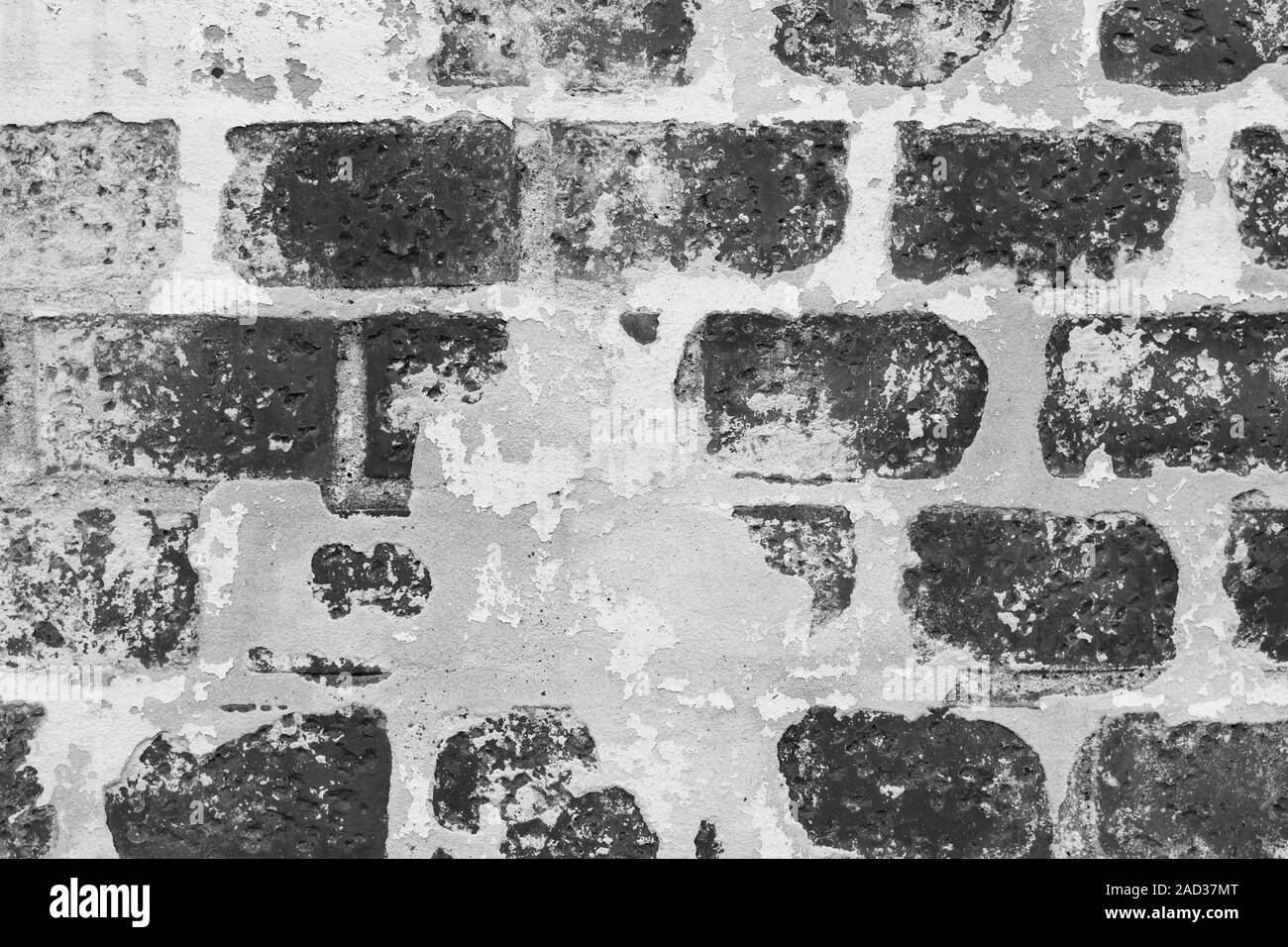 the texture of an old brick wall peeling plaster Stock Photo - Alamy