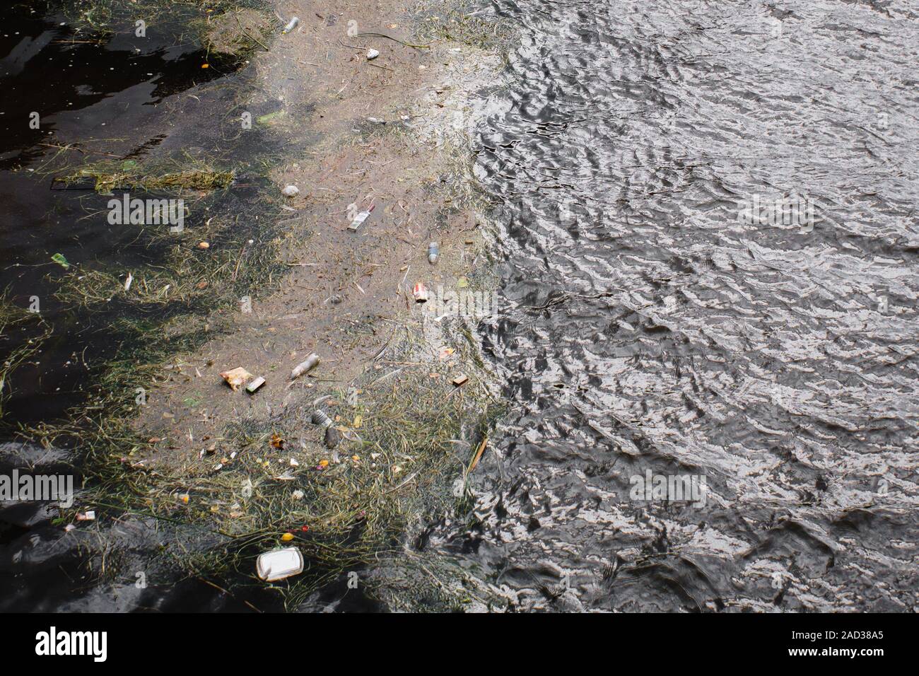 waste in the river environmental pollution plastic waste Stock Photo ...