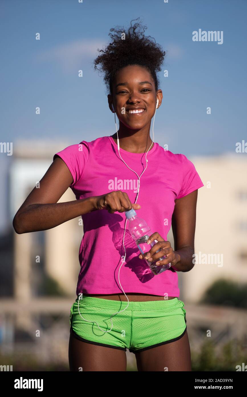 American woman running outdoors hi-res stock photography and images - Alamy