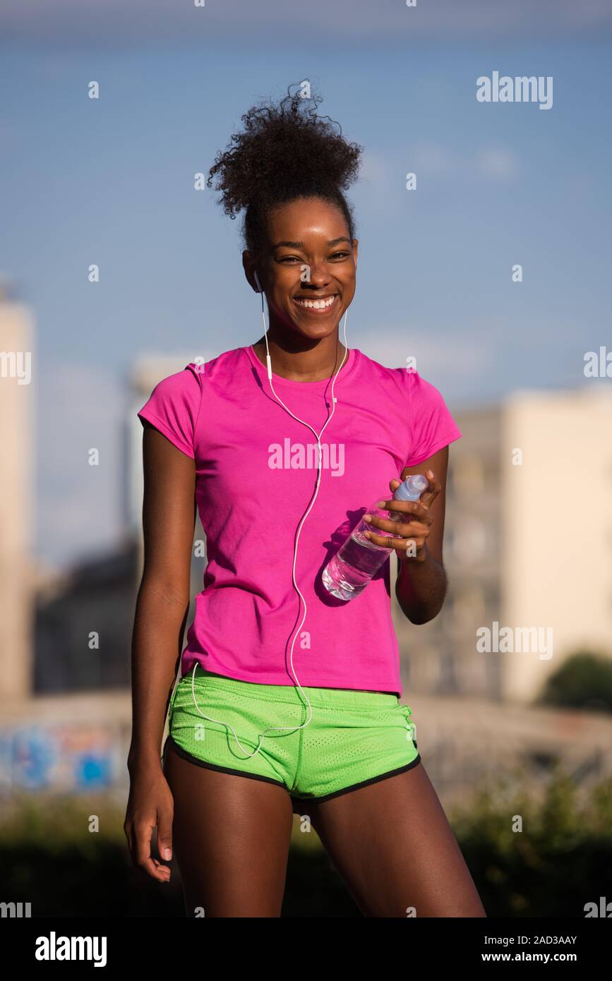 african american woman running outdoors Stock Photo - Alamy
