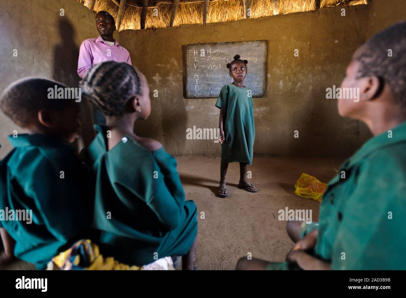 Health education. A young girl reciting a poem in a lesson about HIV ...