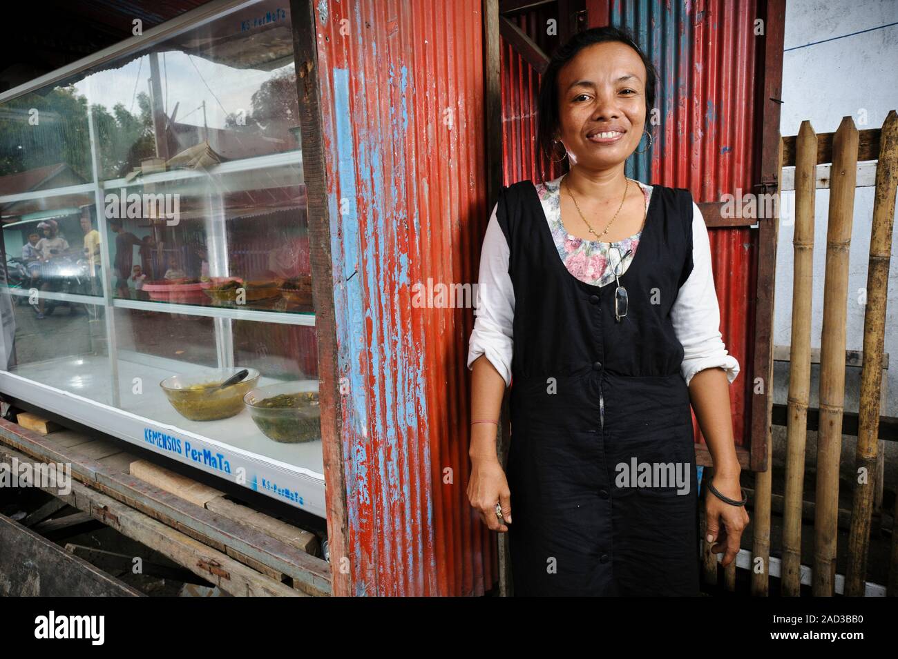 Leprosy settlement. A woman with leprosy running a mobile food stall at ...