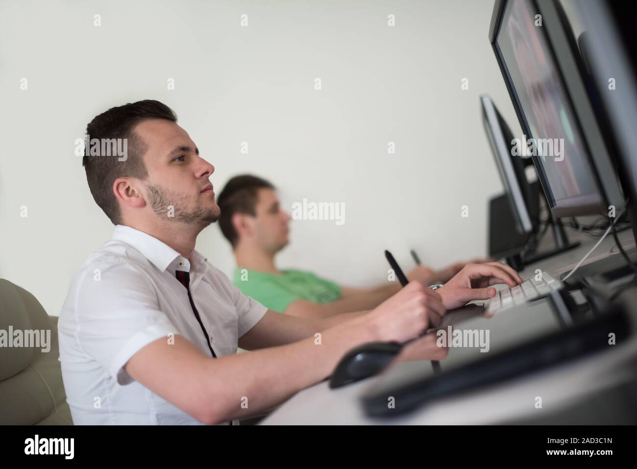 a group of graphic designers at work Stock Photo - Alamy
