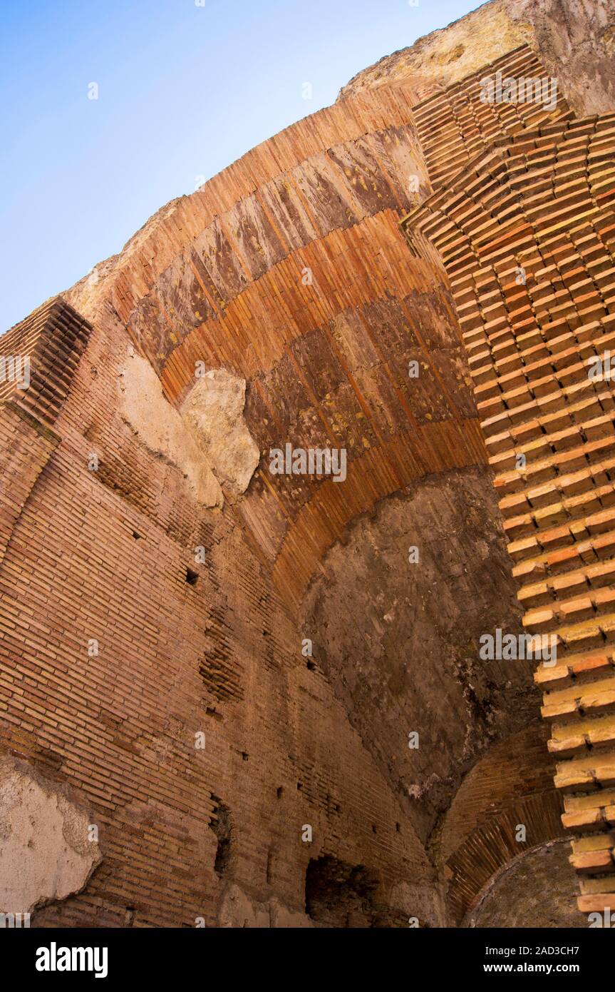 Internal brick-built arch of the Colosseum in Rome. Also known as the ...