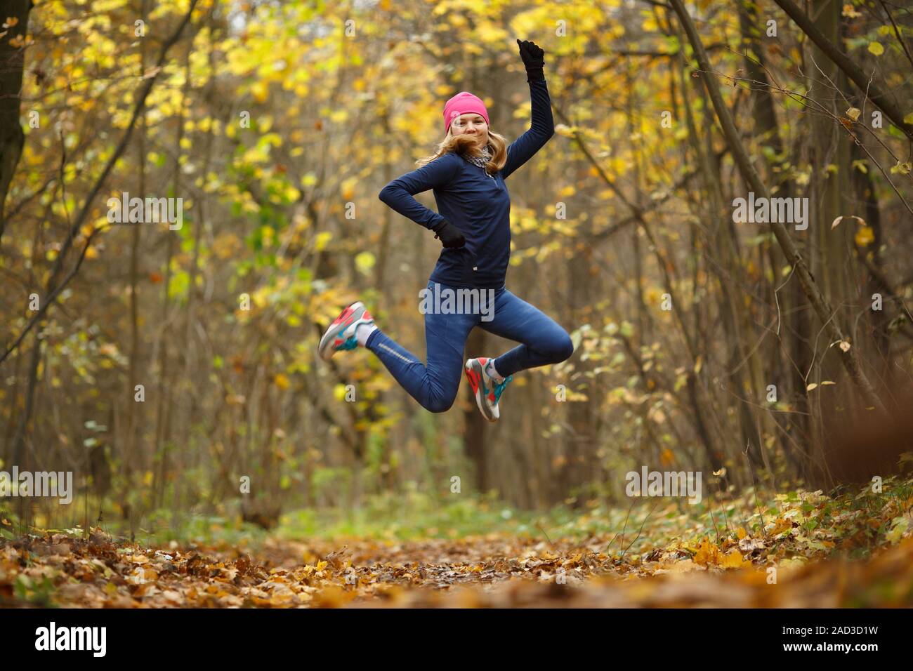Woman among autumn leaves hi-res stock photography and images - Alamy