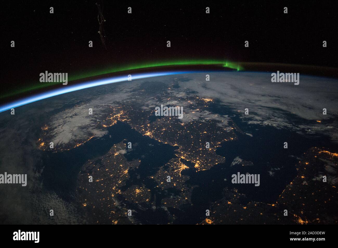 Scandinavia at night, ISS image. The aurora is visible at the top of ...