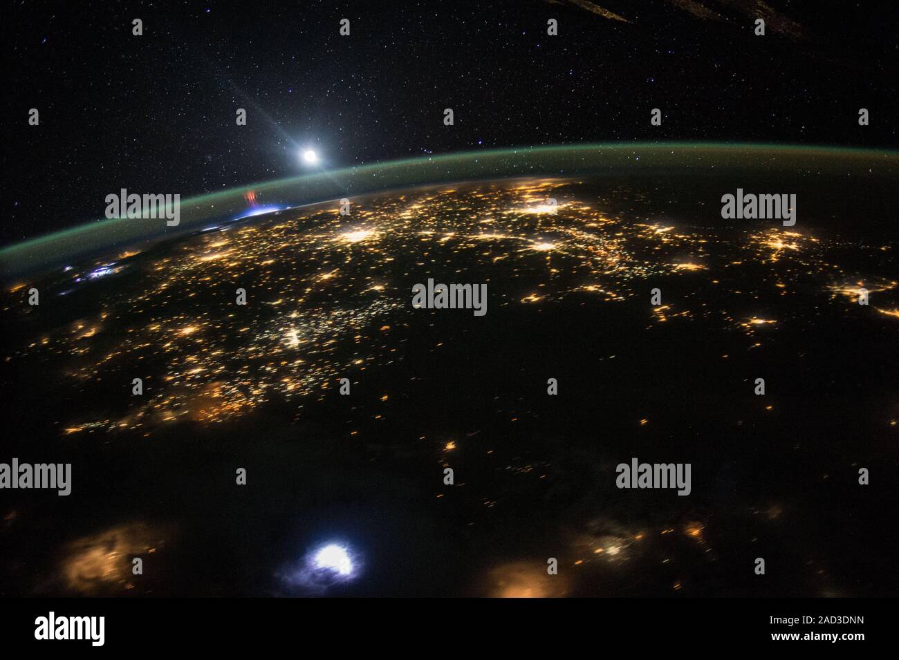 Red sprite over storm, ISS image. Photograph of Earth at night over ...