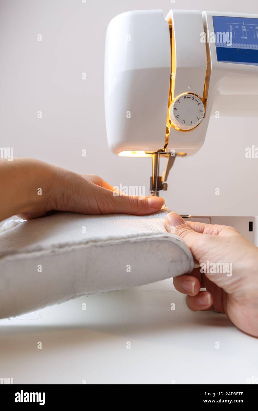 Sewing machine with girl close-up Stock Photo - Alamy