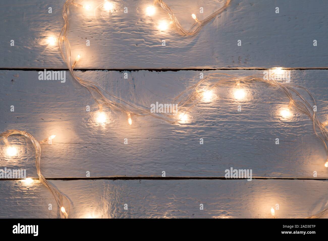 Christmas festoon on wooden floor Stock Photo - Alamy