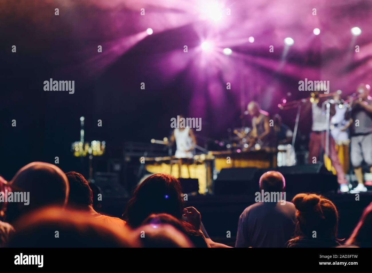 Blurred Crowd at concert of unrecognizable music group and blurred ...