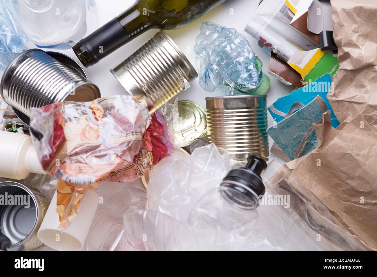 Garbage lies on white table Stock Photo - Alamy