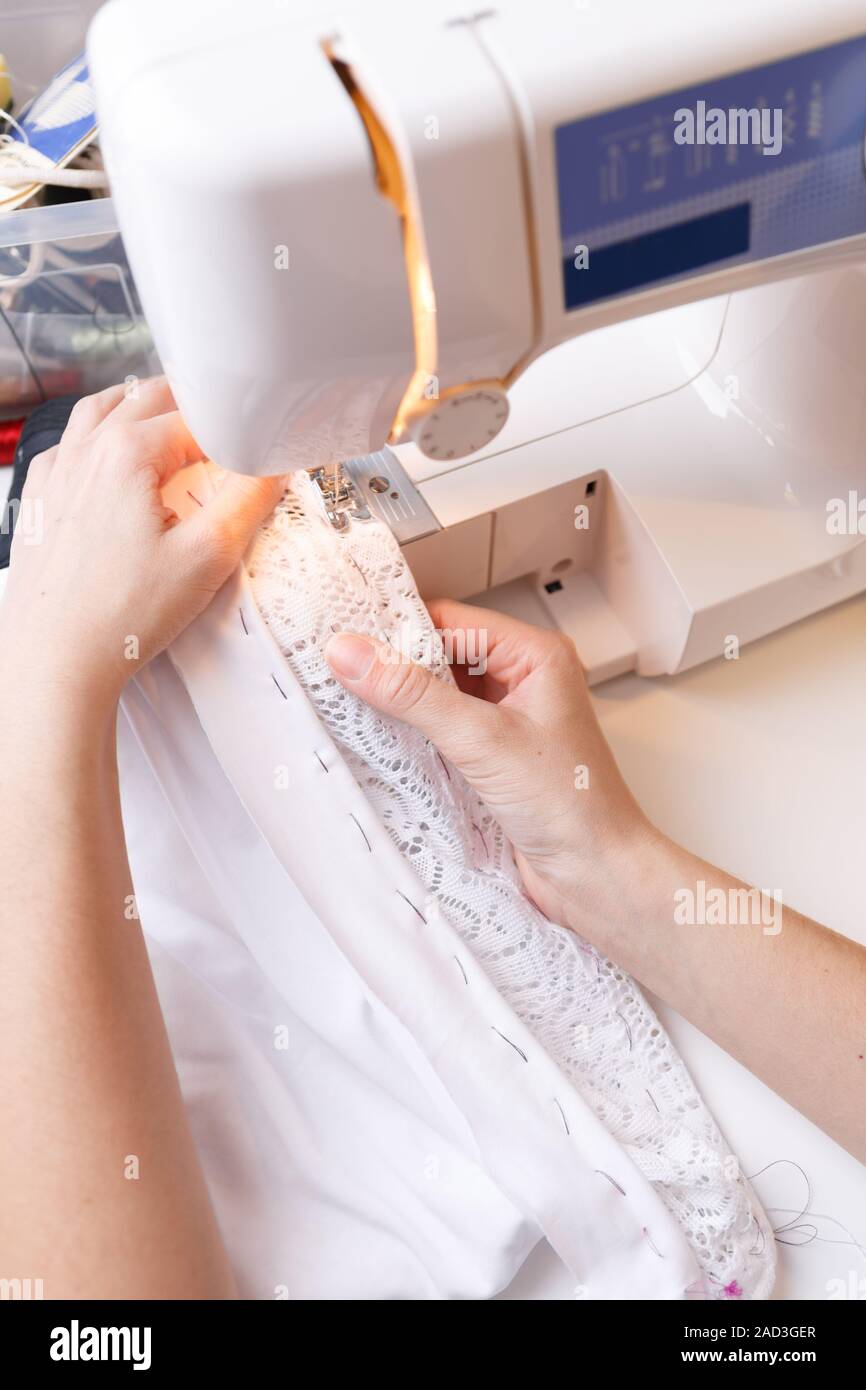 Photos of sewing-machine, hand woman Stock Photo - Alamy