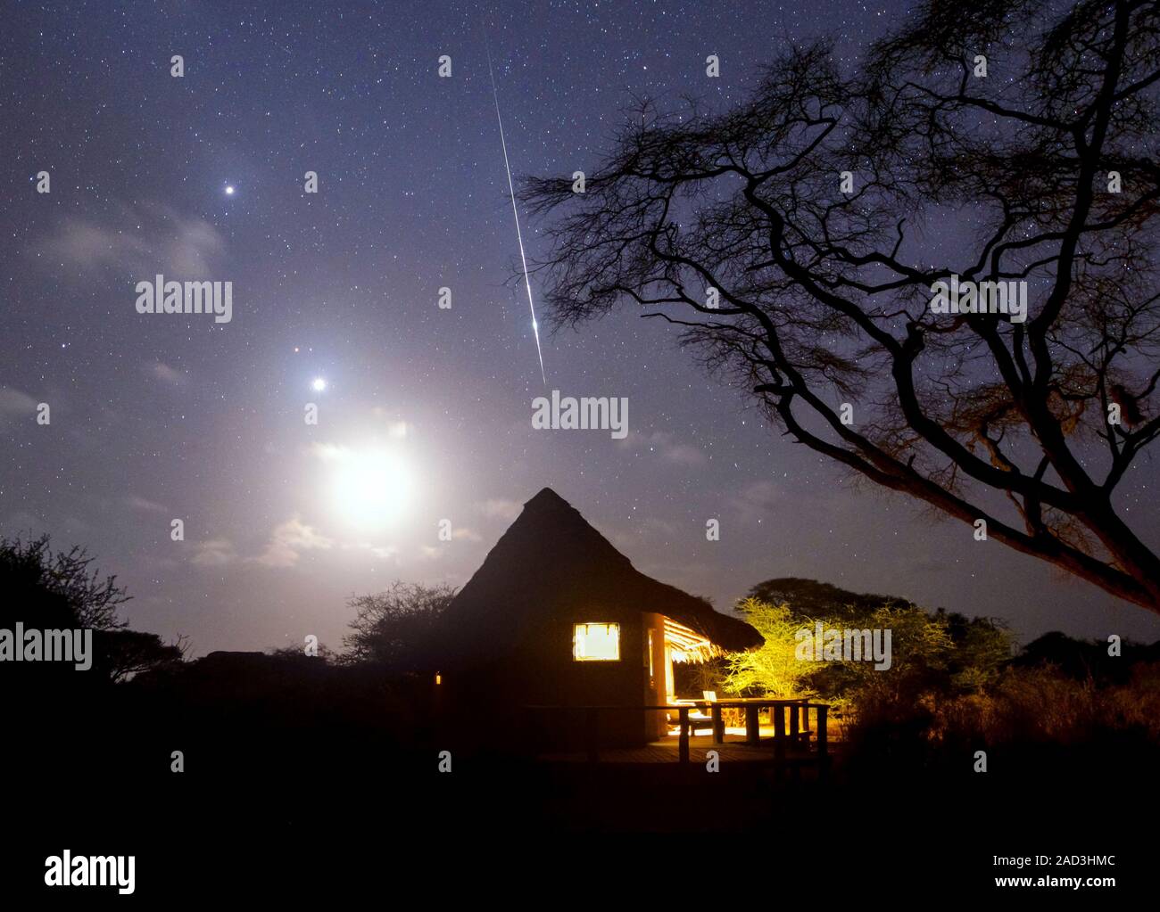 Taurid meteor shower. View of a meteor (shooting star, upper centre) in ...