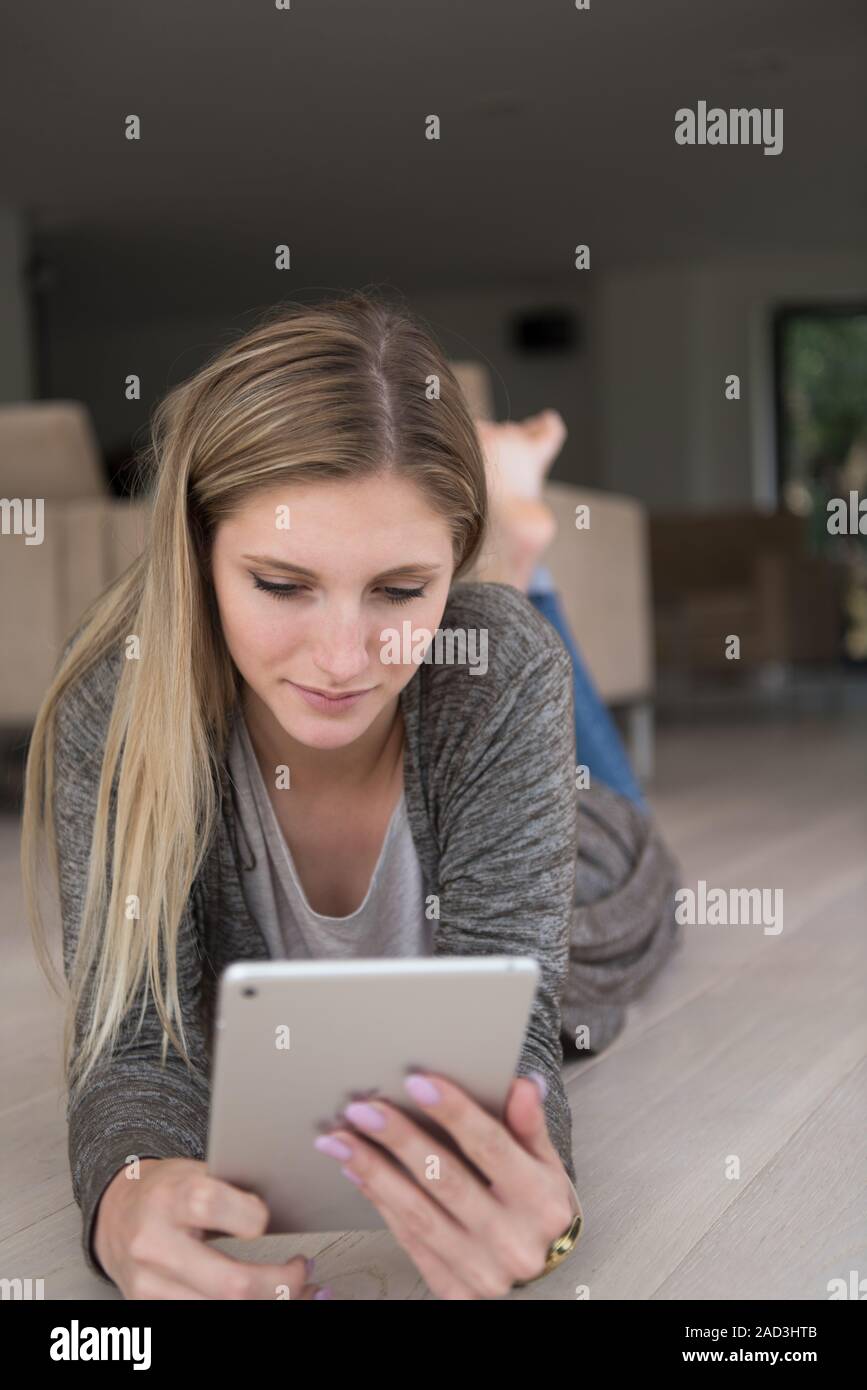 young women used tablet computer on the floor Stock Photo - Alamy