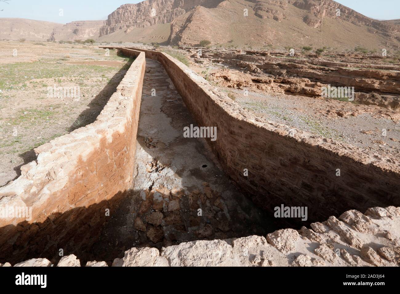Dry canal. View over a dry canal in the Sahara Desert, Morocco. In ...