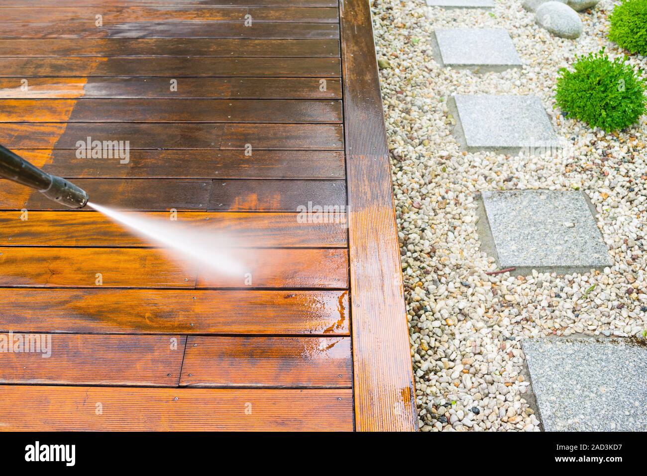 cleaning terrace with a pressure washer Stock Photo - Alamy