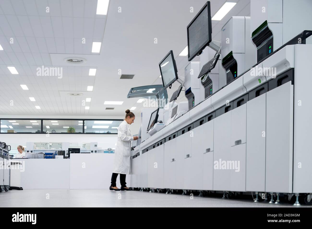 Haematology laboratory. Haematologist using an XN-9000 blood analysis ...