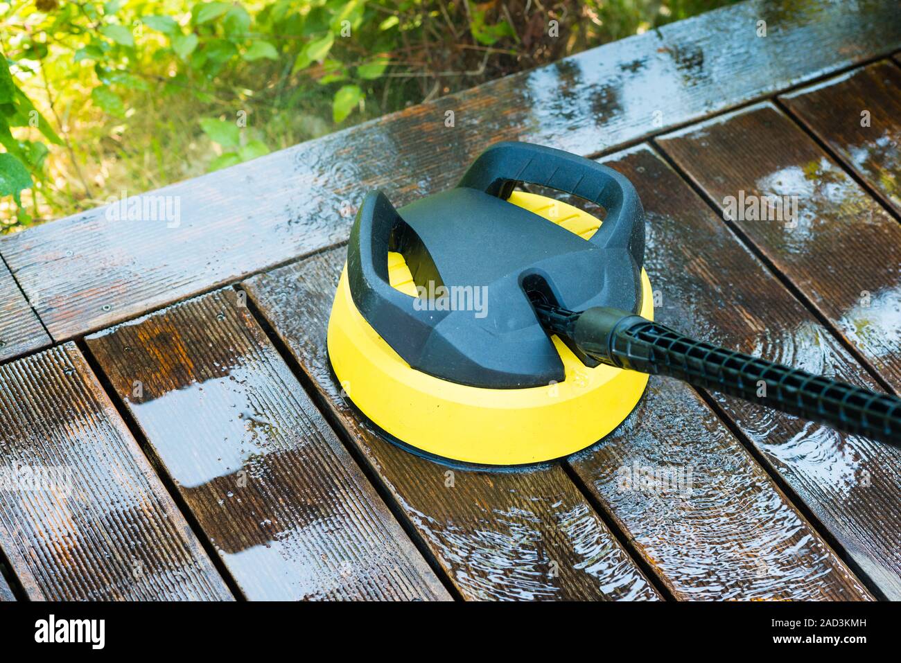 cleaning terrace with a pressure washer Stock Photo - Alamy