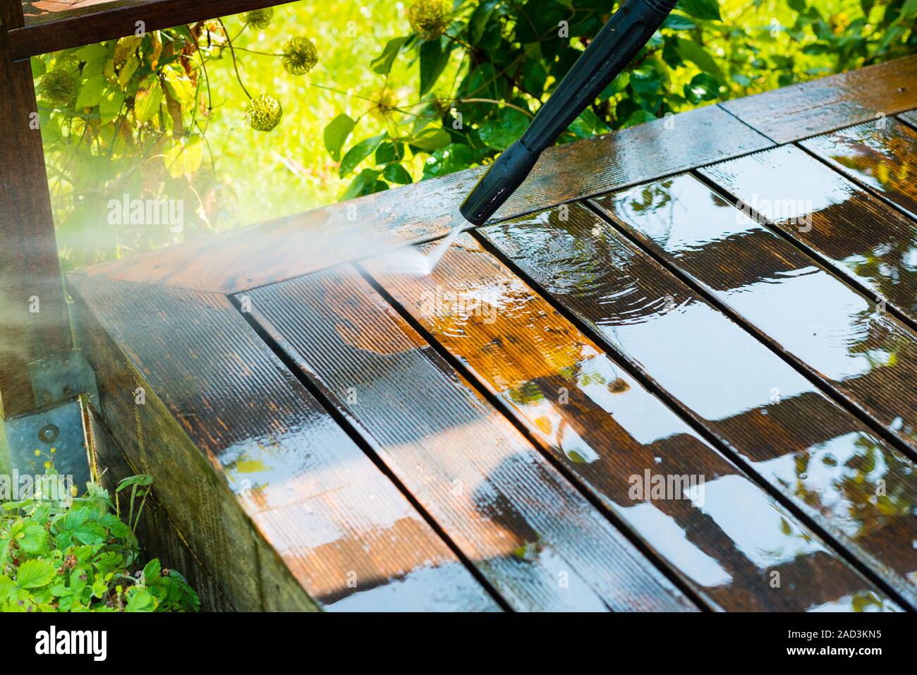 cleaning terrace with a pressure washer Stock Photo - Alamy