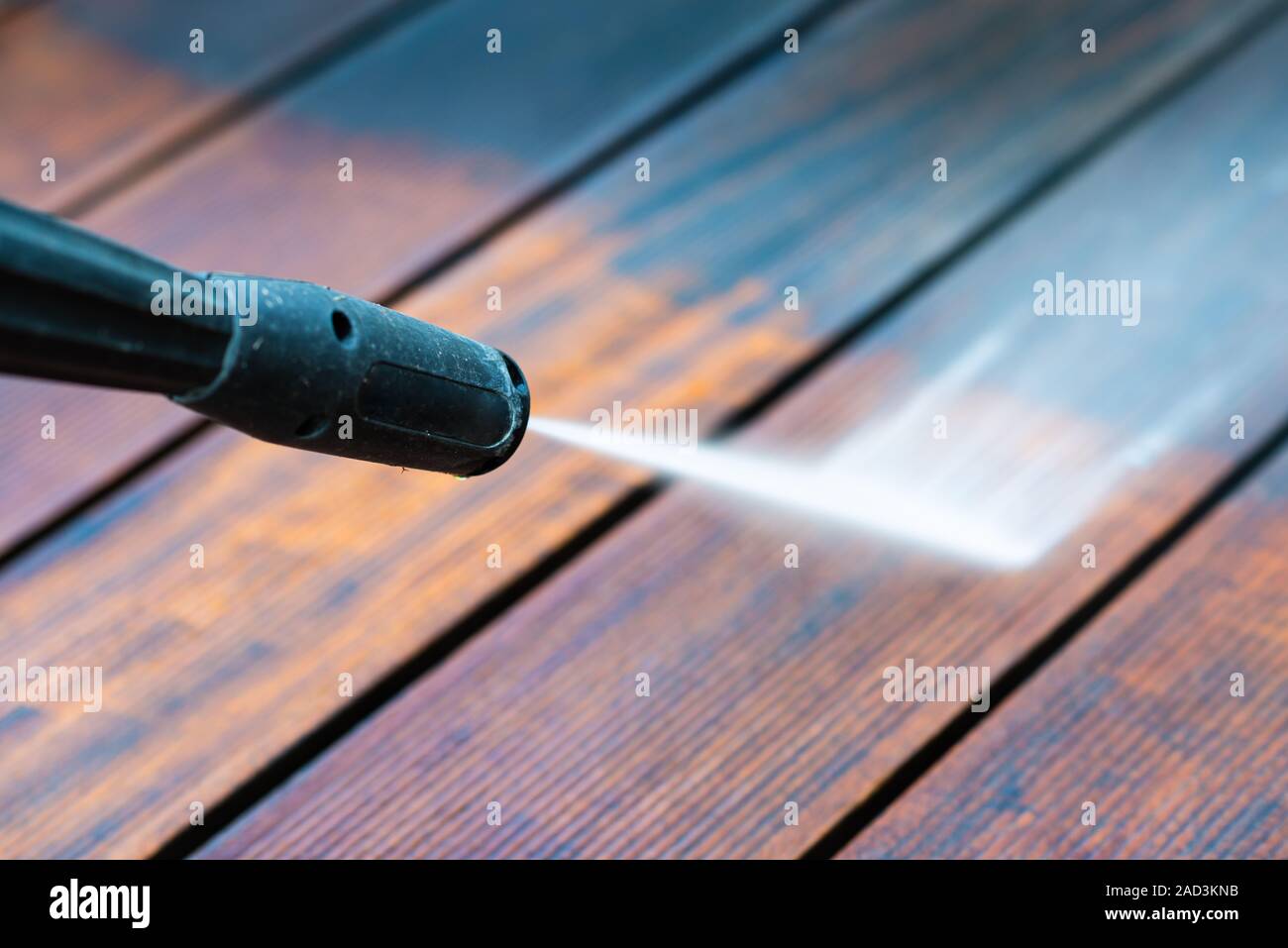 cleaning terrace with a pressure washer Stock Photo - Alamy