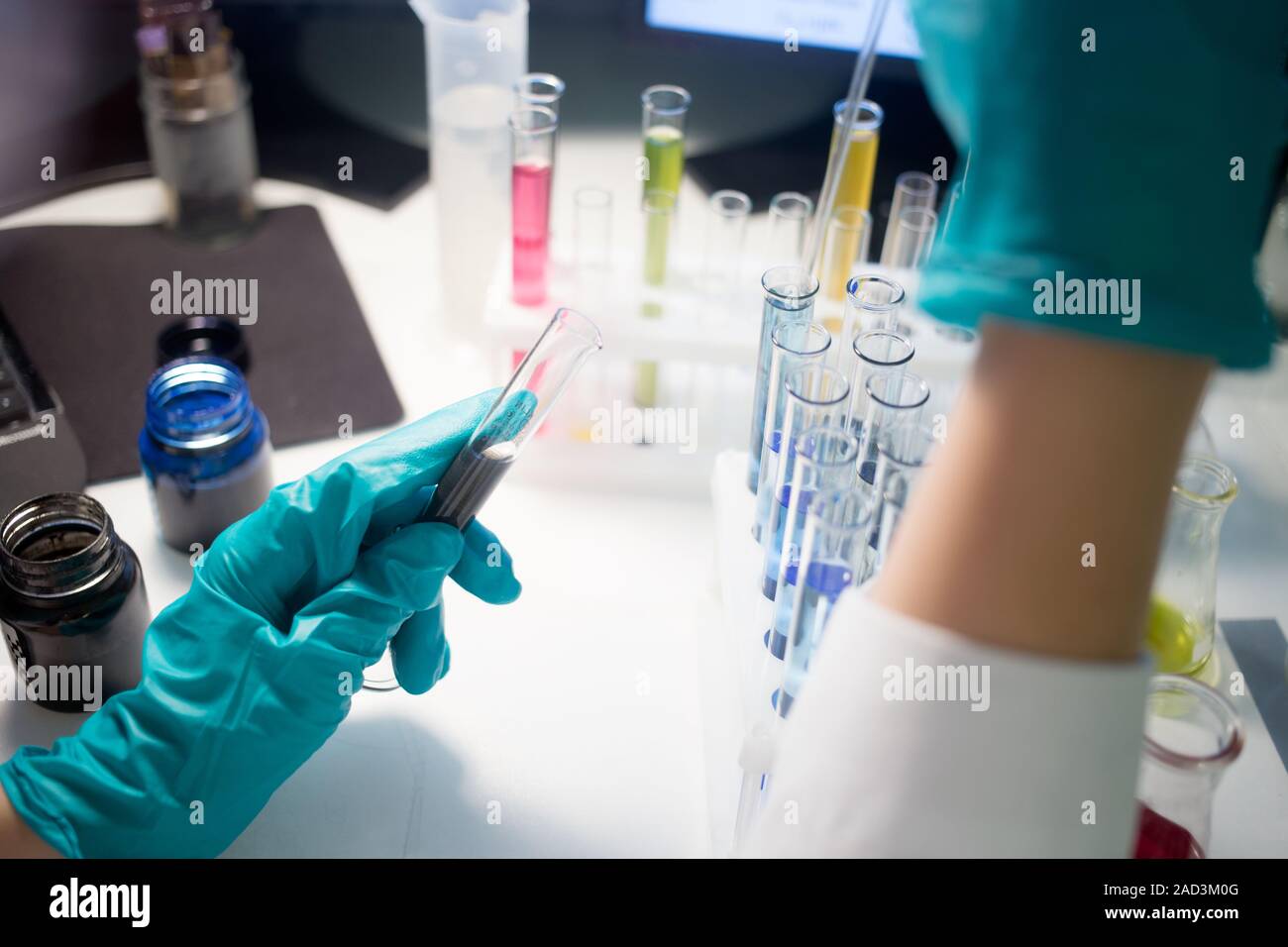 Worker chemical lab with tubes Stock Photo - Alamy