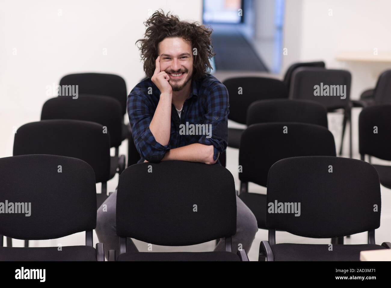 A student sits alone in a classroom Stock Photo - Alamy