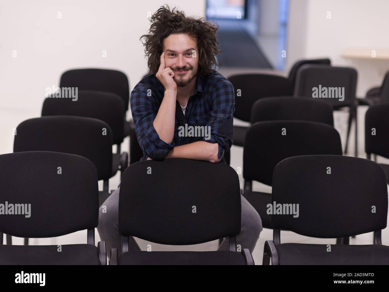 A student sits alone in a classroom Stock Photo - Alamy