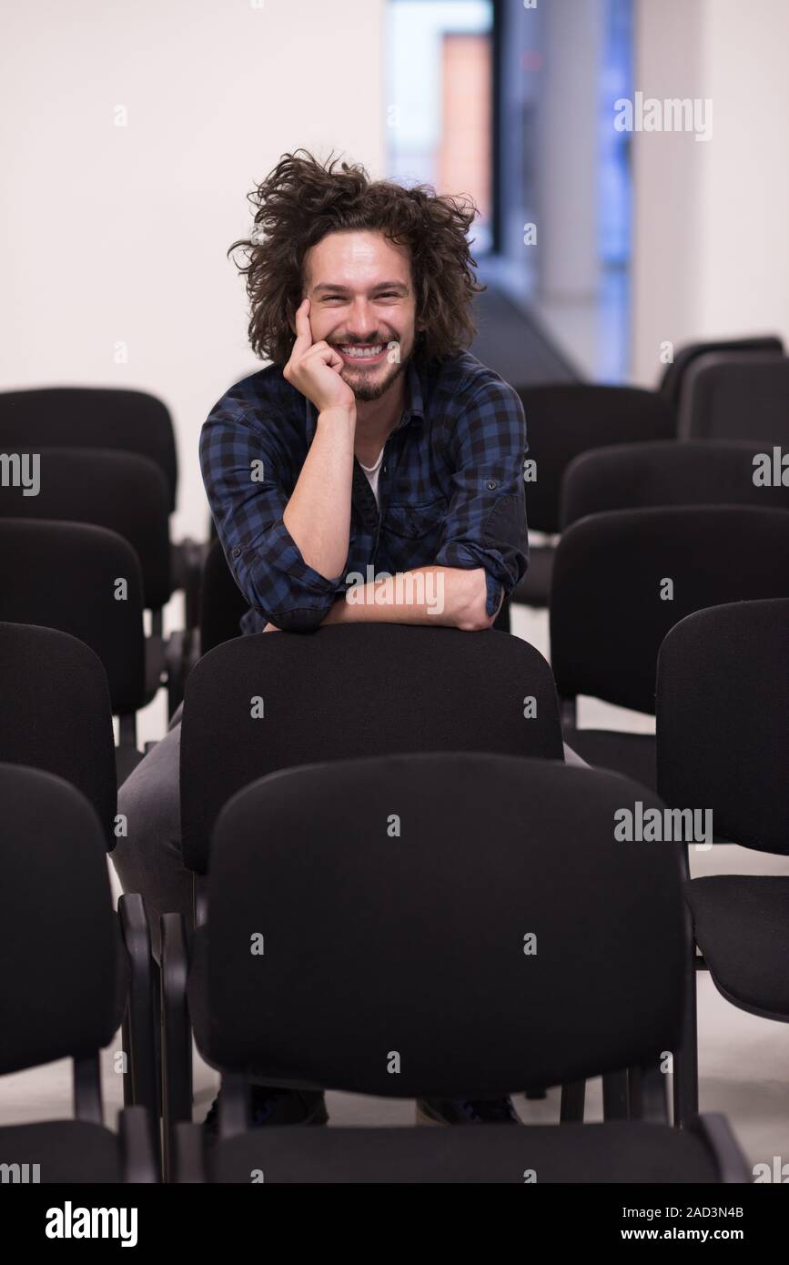 A student sits alone in a classroom Stock Photo - Alamy