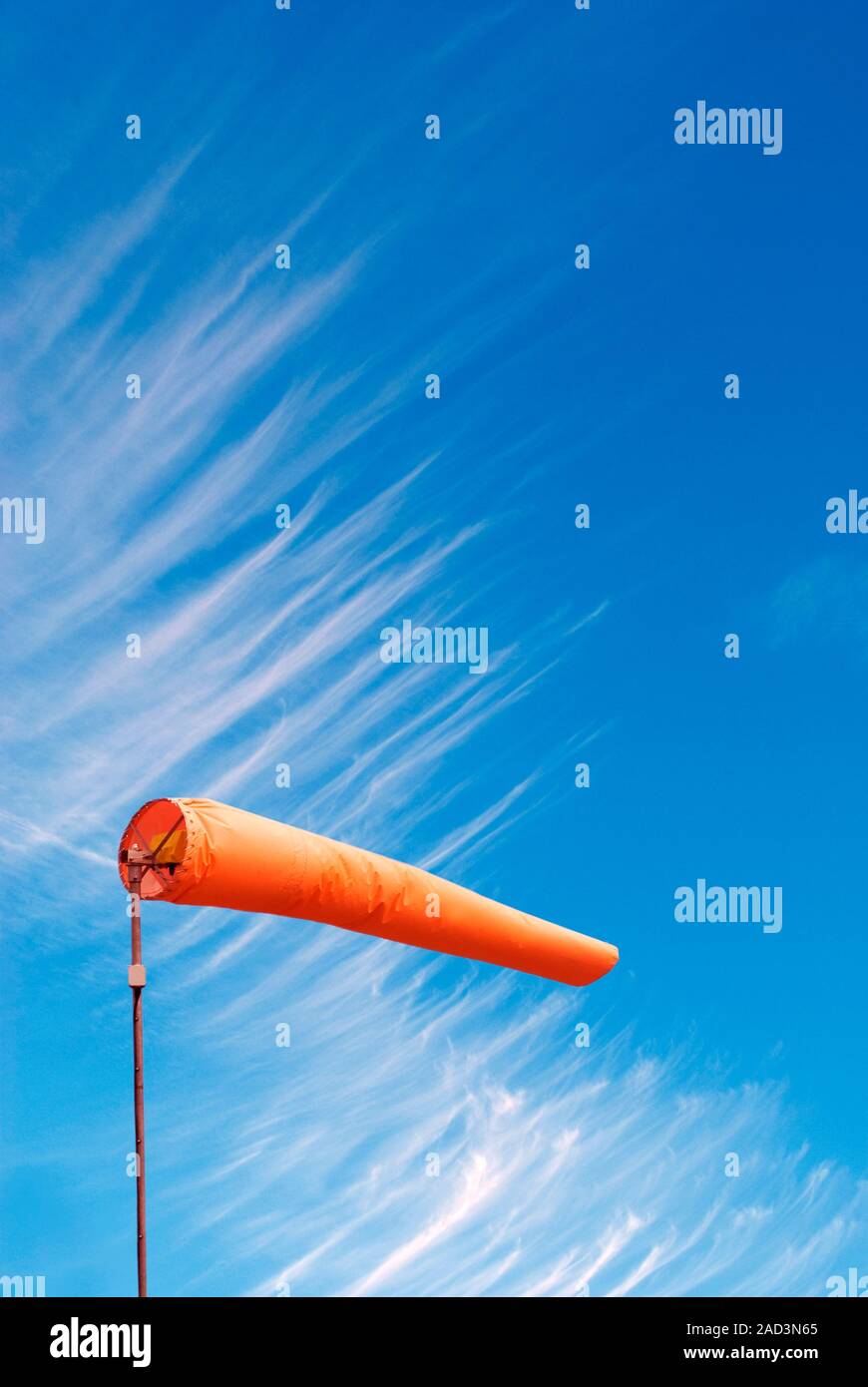 Windsock blowing in the wind against clouds in the sky Stock Photo - Alamy