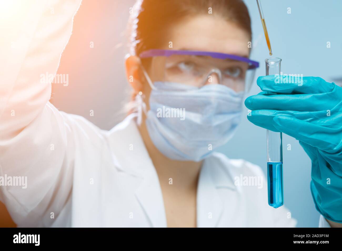 Laboratory assistant with test tube Stock Photo - Alamy