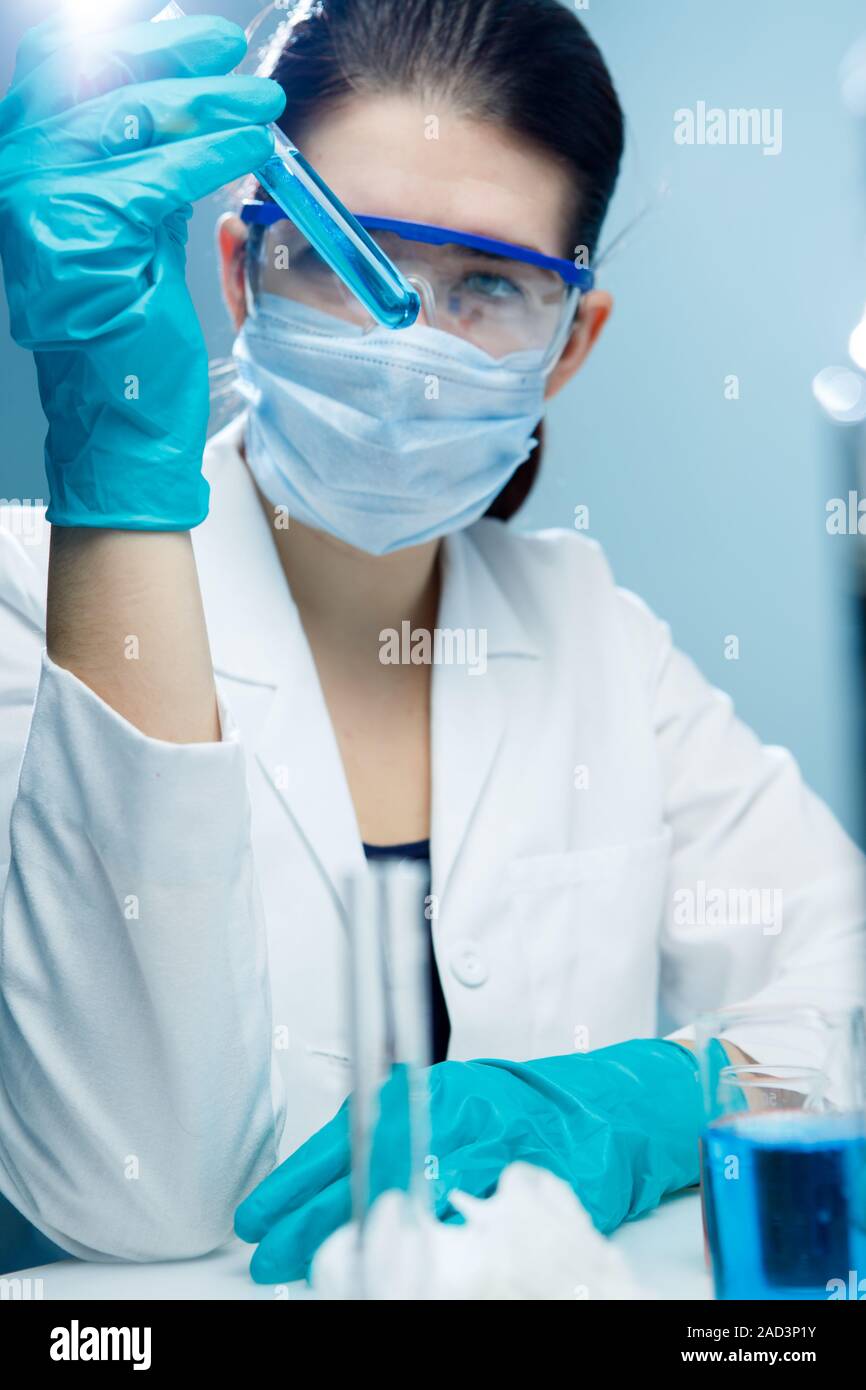 Student working with test tubes Stock Photo - Alamy