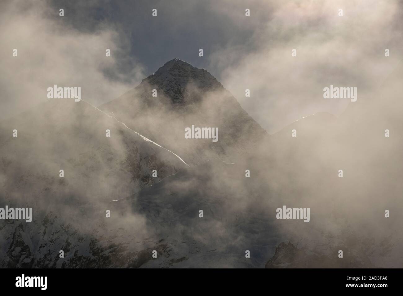 Close-up of the summit of Mt. Everest, monsoon clouds rising up, seen ...