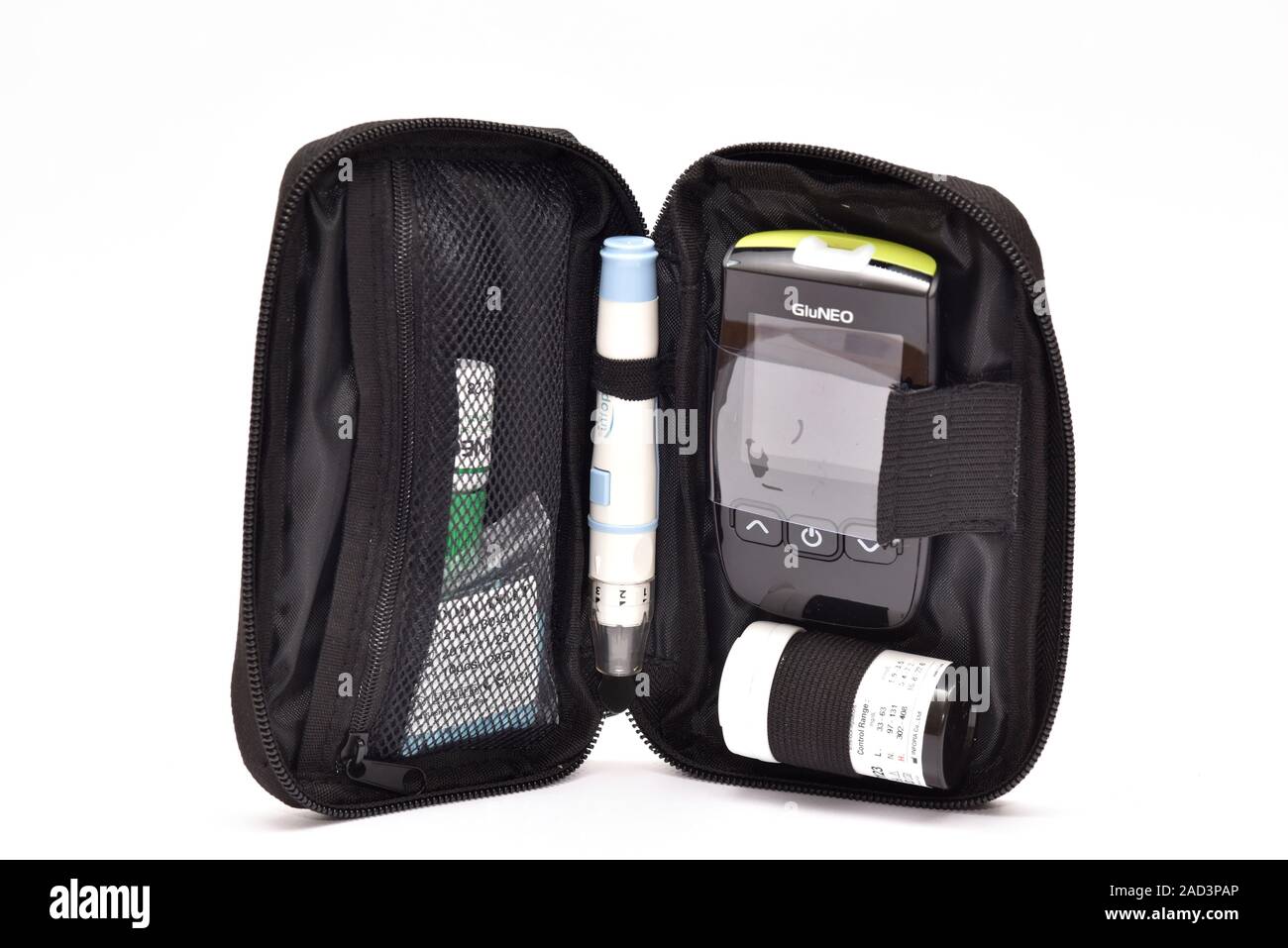 Blood glucose monitor. Pouch containing a digital monitor (glucometer ...
