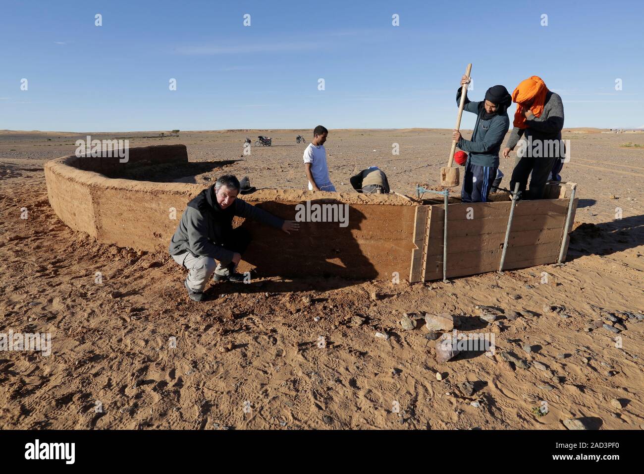 Dune barrier testing. Researchers testing out a scale version of a dune ...