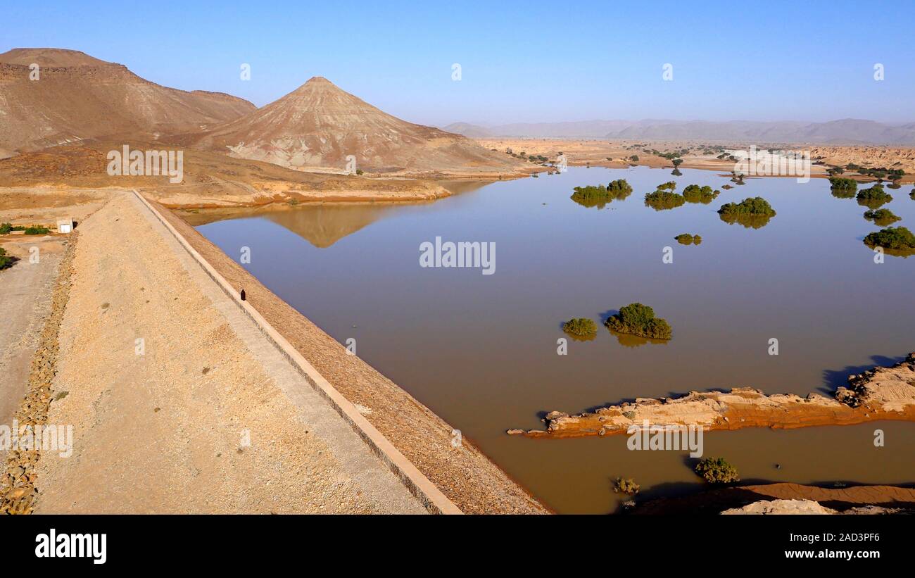Desert reservoir. View over a man-made water basin in the Sahara Desert ...