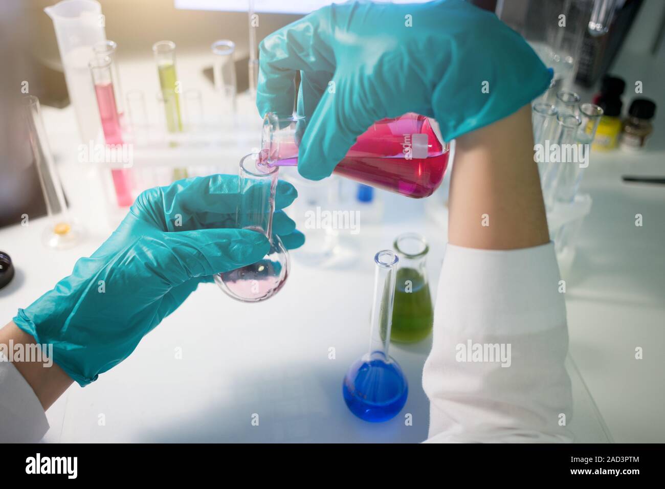 Chemical lab with technician, flasks Stock Photo - Alamy