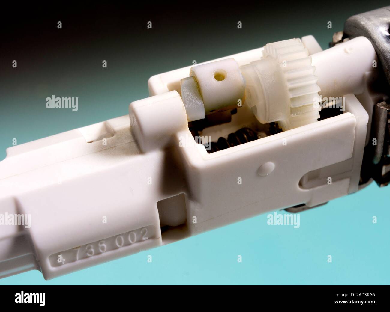 Part of the gear and cam mechanism inside an electric rotation ...