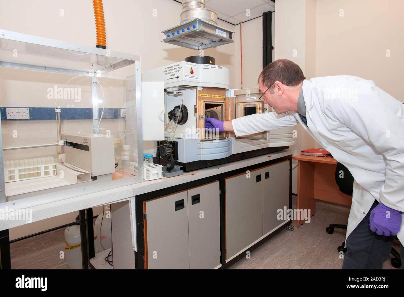 Forensic evidence analysis. Forensic scientist using an X-ray ...