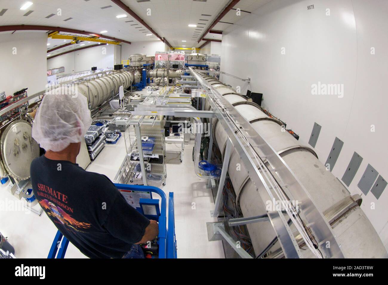 LIGO gravitational wave detector laser. Engineer viewing the laser and ...