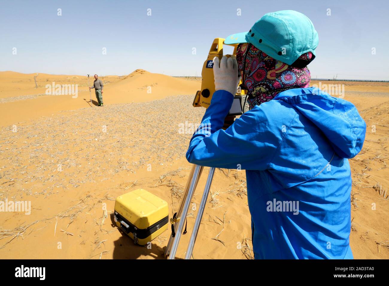 Desert surveying. Researchers surveying the Tengger Desert, China. This ...
