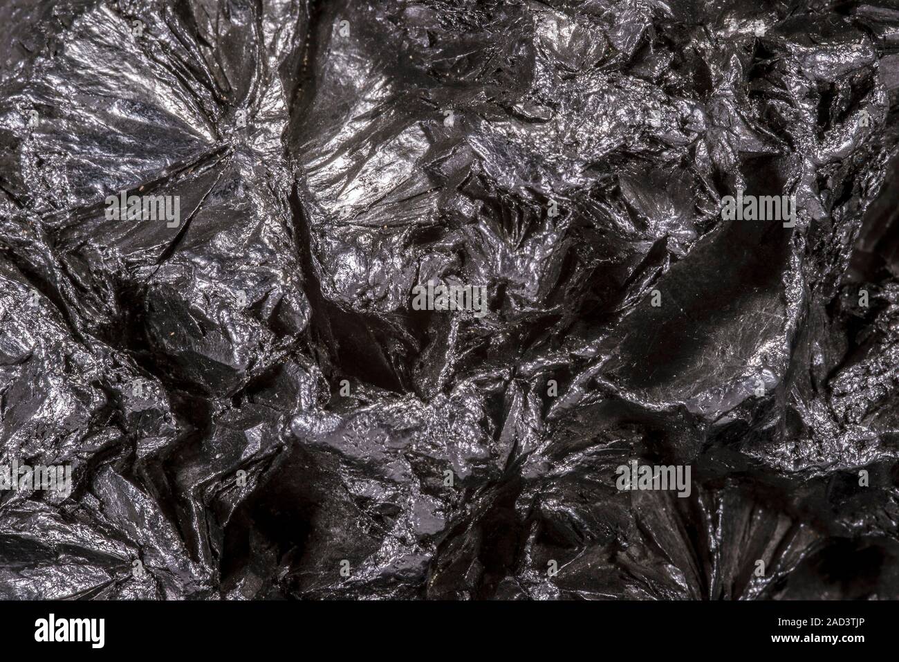 Graphite. Close-up of a sample of graphite. Graphite is an allotrope of ...