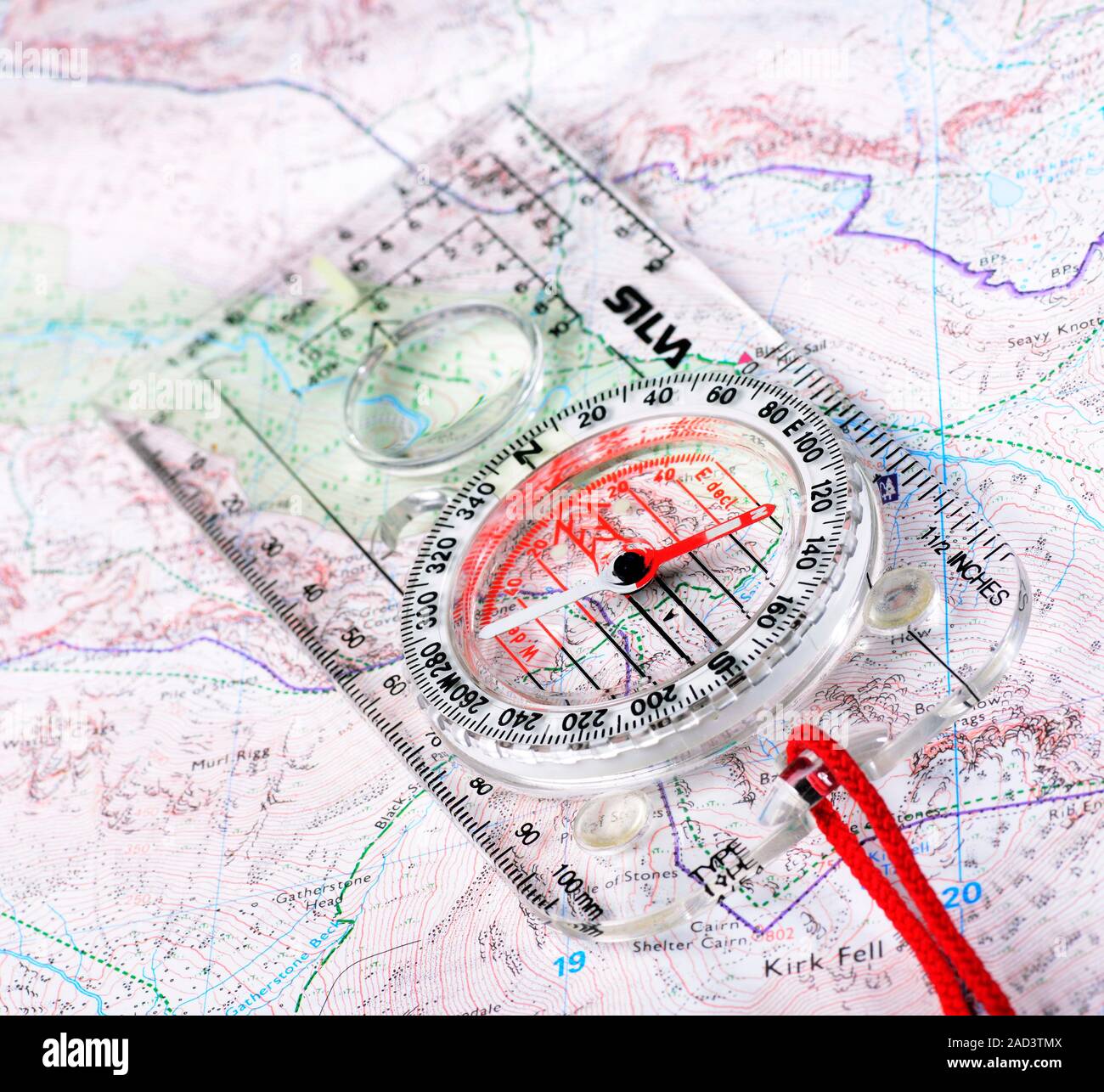 Compass and map. The compass has a free-swinging magnetic needle (red ...