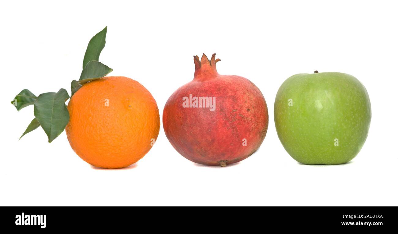 Pomegranate, orange, and apple isolated on white background Stock Photo ...