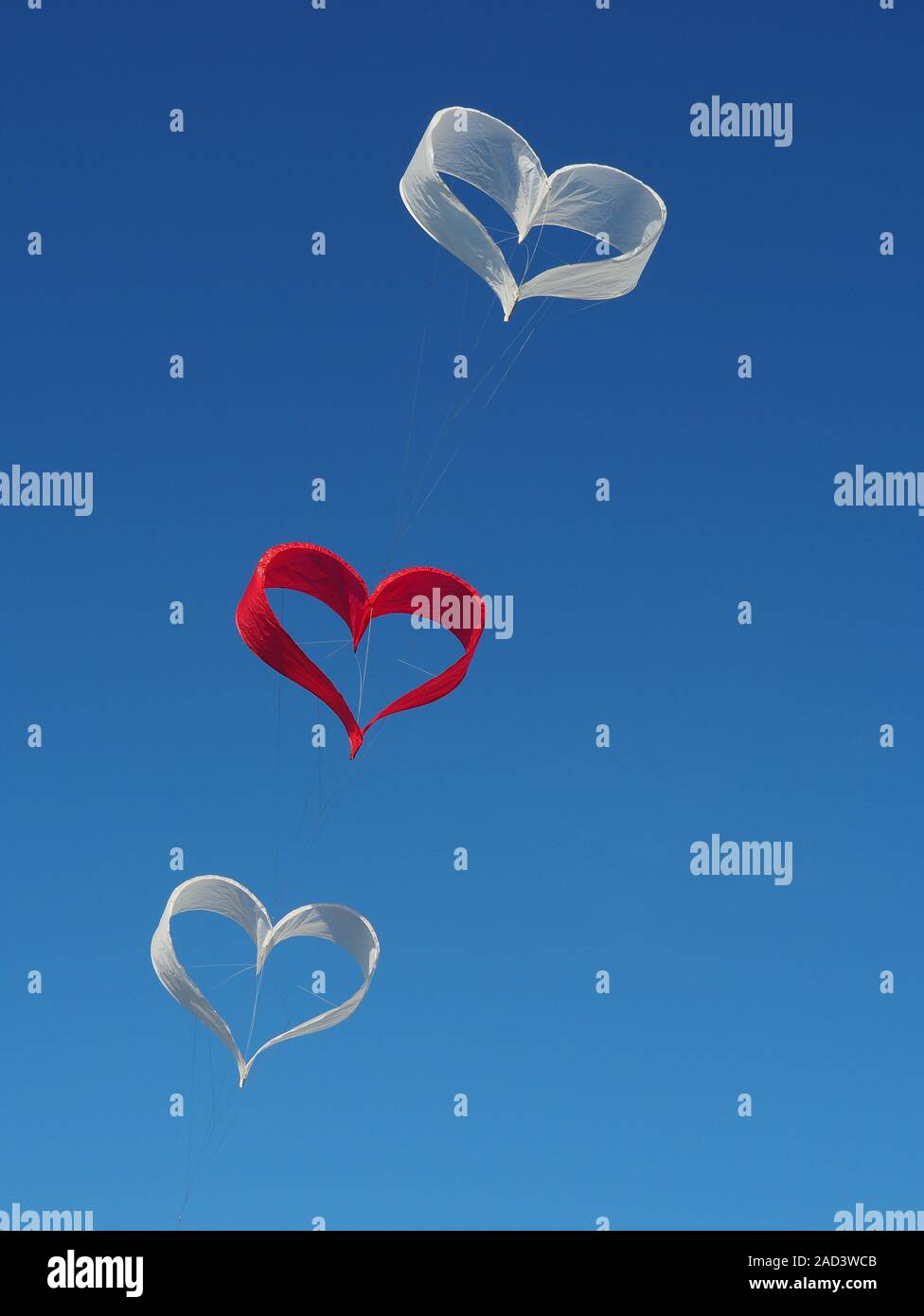 Flight kite in heart shape - kite festival Stock Photo - Alamy