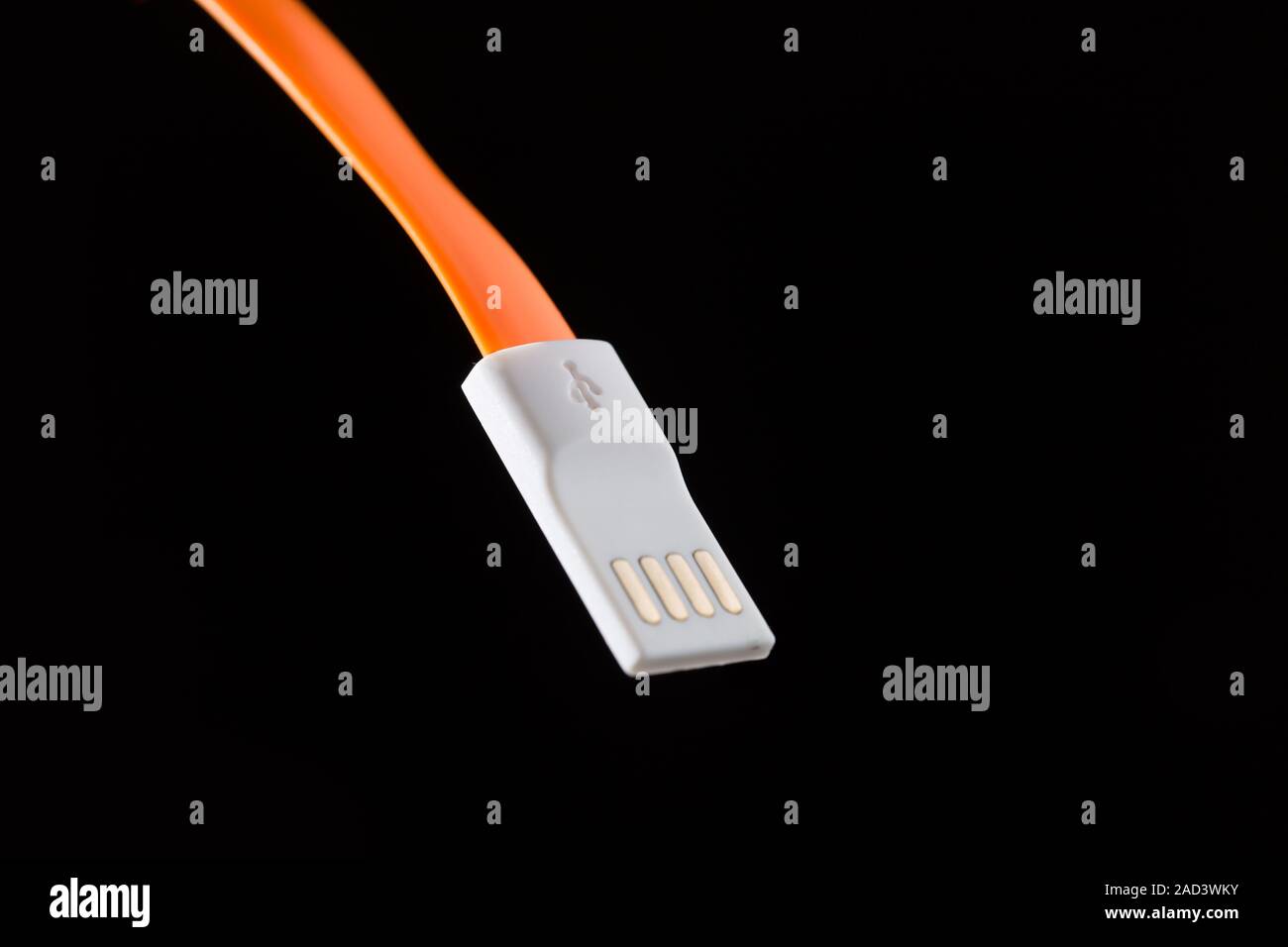 Orange cable on isolated background Stock Photo - Alamy