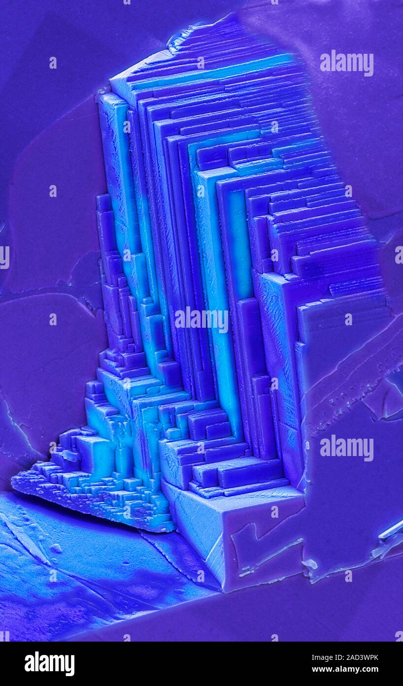 Sapphire. Coloured scanning electron micrograph of a fractures sapphire ...