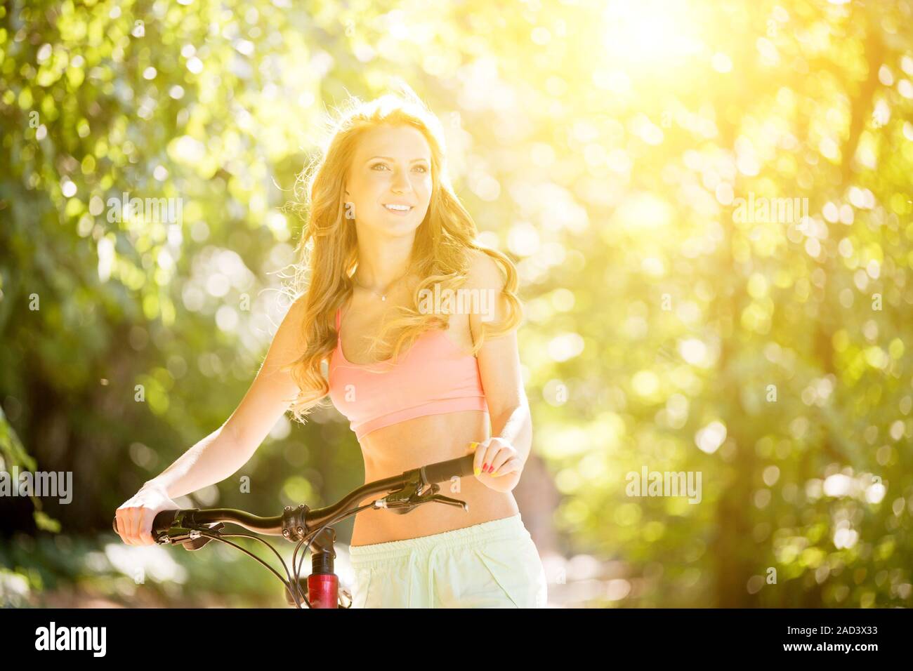 Ginger young girl on bicycle Stock Photo - Alamy
