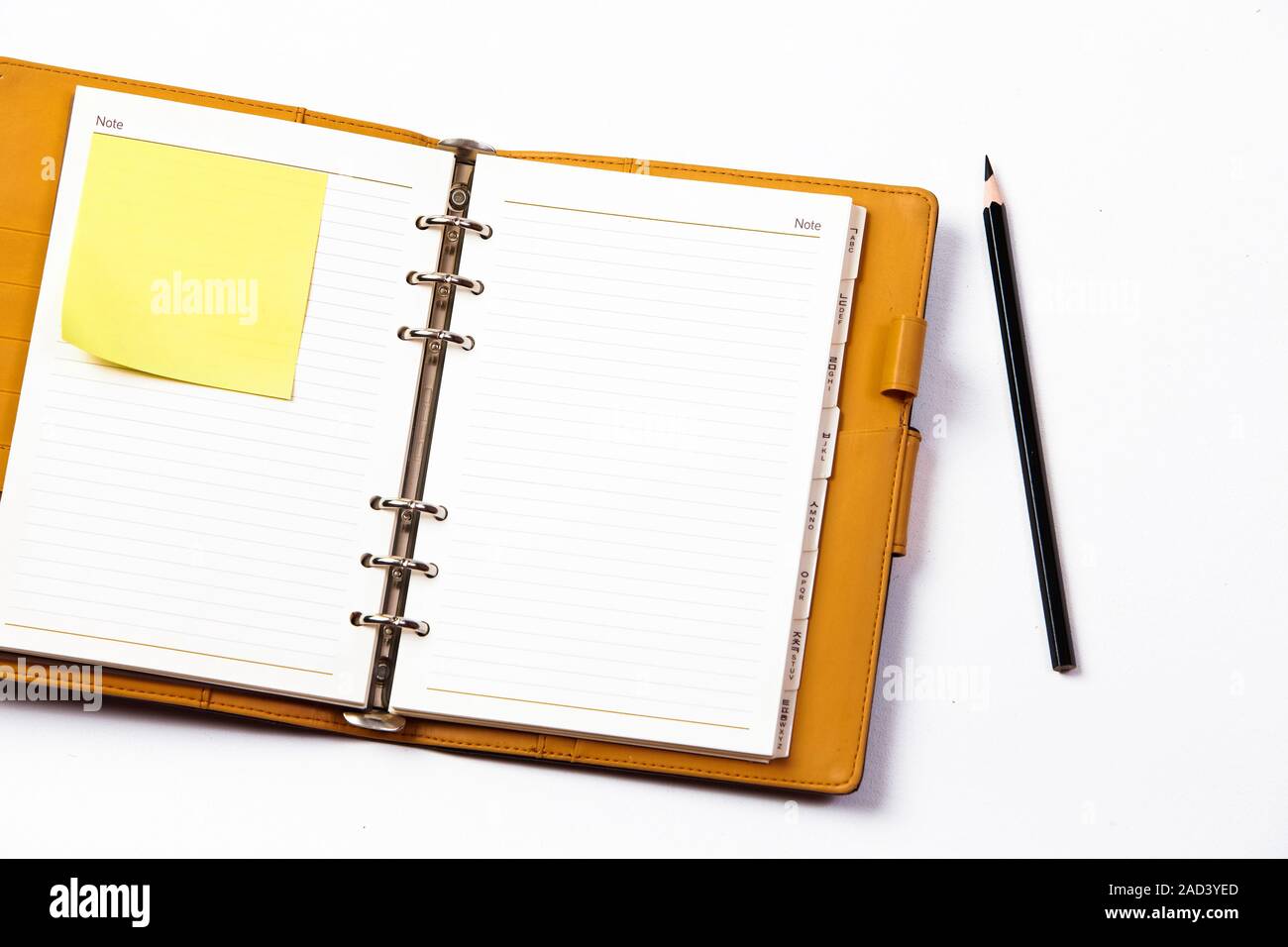 Open dairy with sticky and pen Stock Photo - Alamy