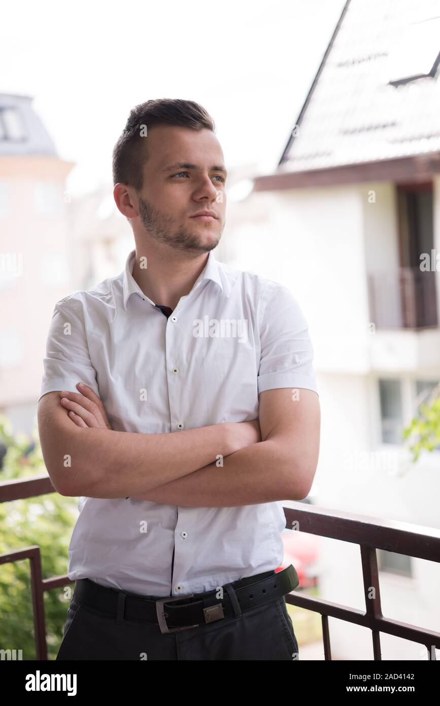 man standing at balcony Stock Photo - Alamy